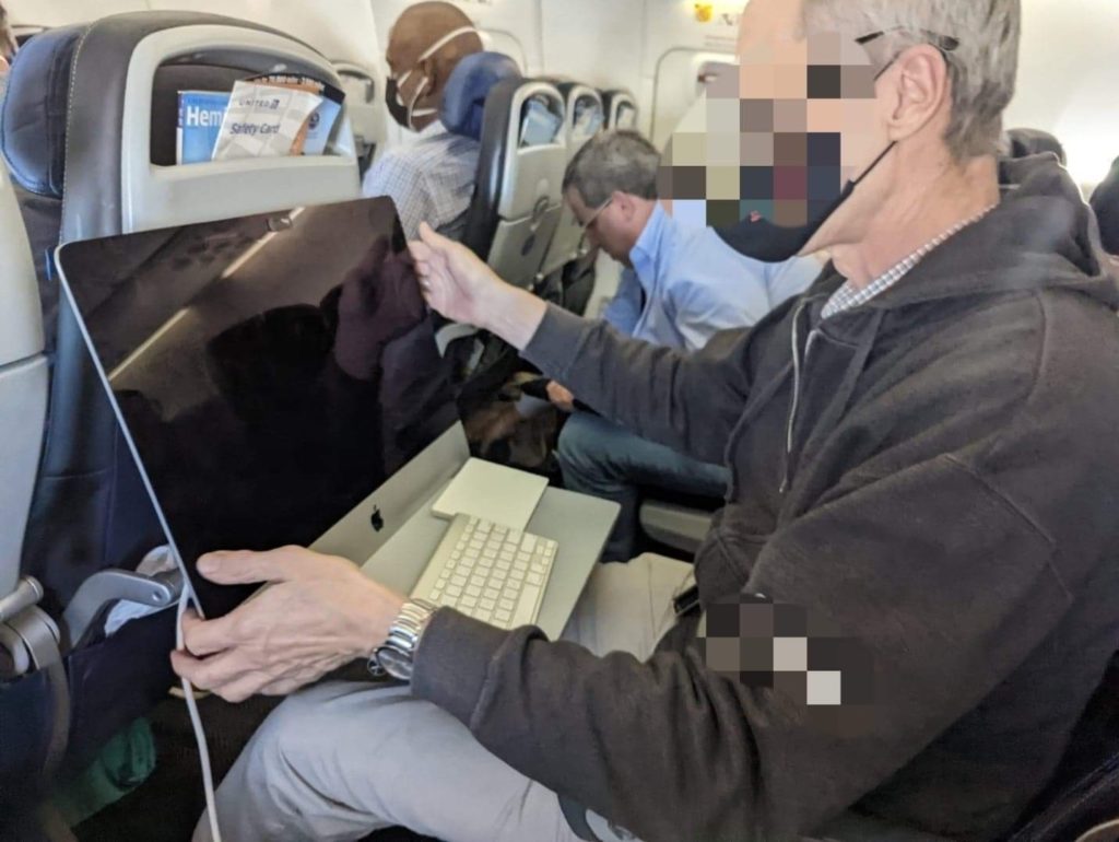 Man Uses Huge iMac In Economy Class - Is This A Joke? - Live and Let's Fly